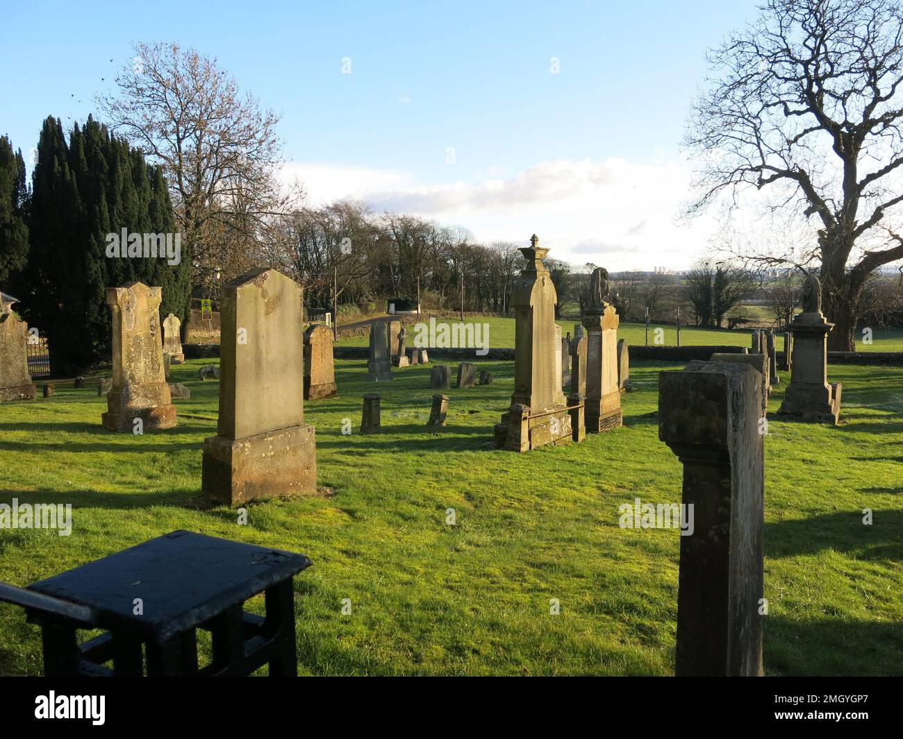 Scottish country churchyard: gravestones in the winter sunlight in the ...
