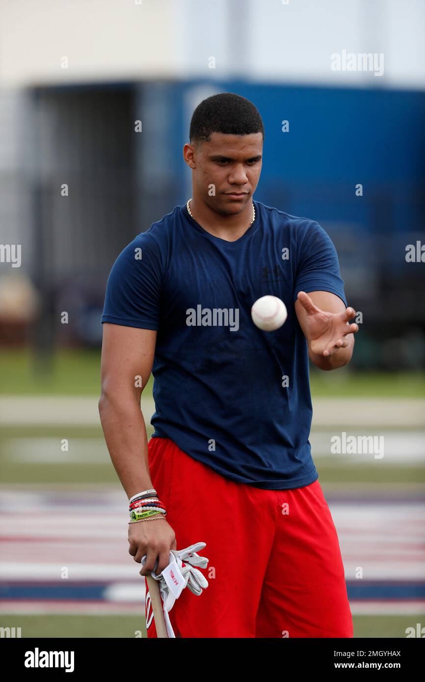 Washington Nationals outfielder Juan Soto catches a ball during spring ...
