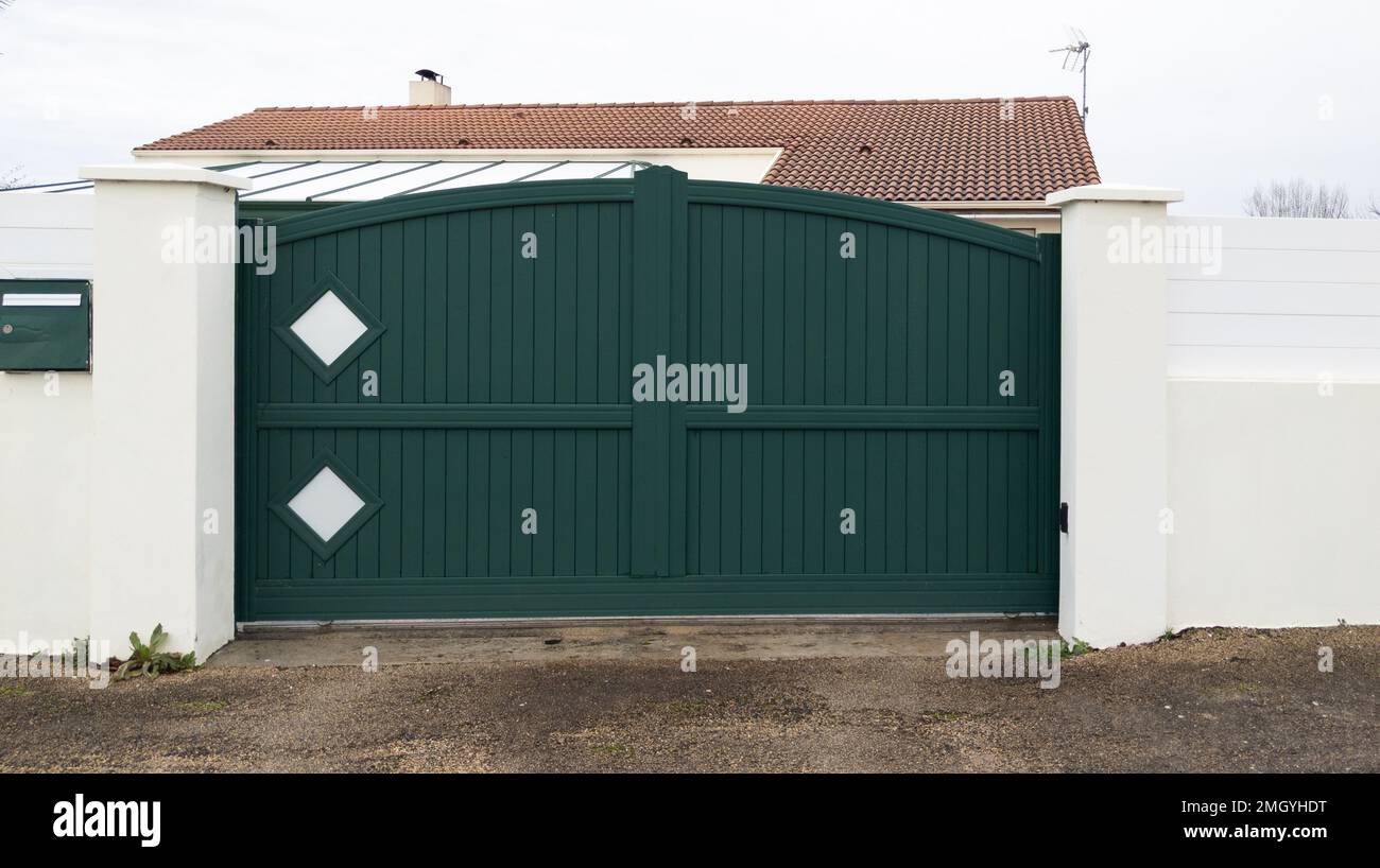 Aluminum portal home green metal gate door of suburb house Stock Photo ...