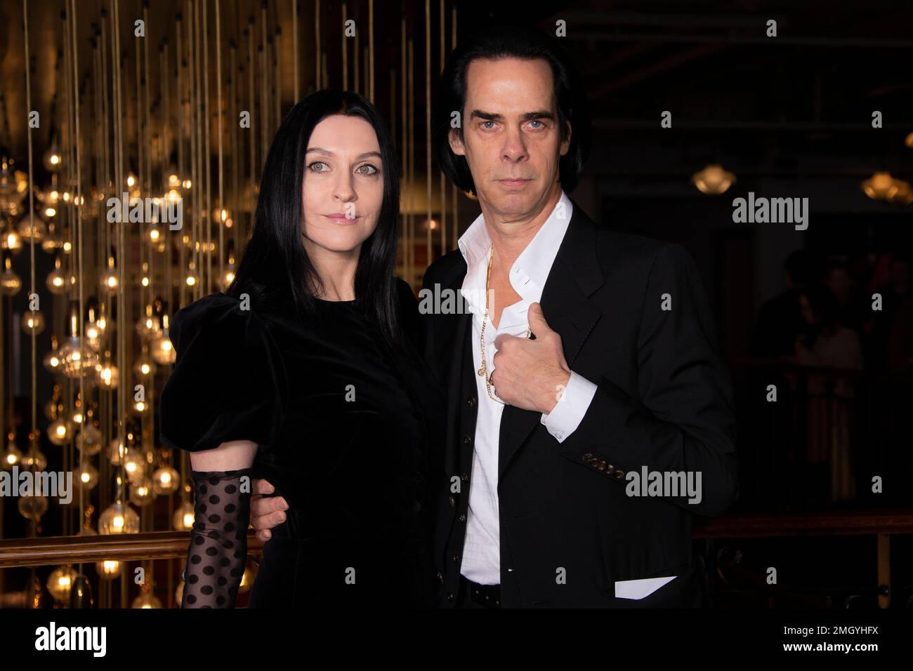 Musician Nick Cave, right, and fashion designer wife Susie Bick pose ...