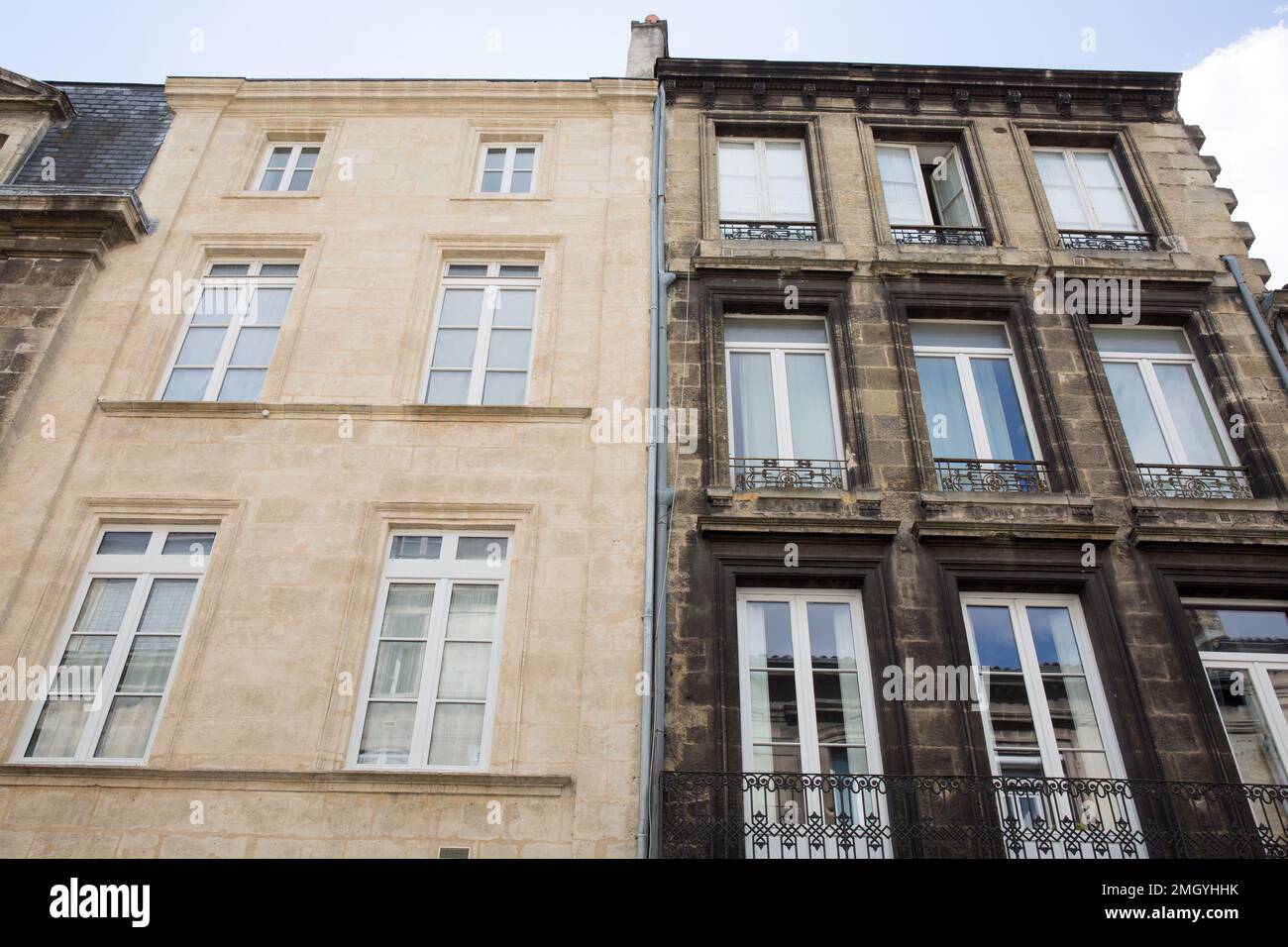 before and after wash cleaned house facade and a dirty one in a city ...