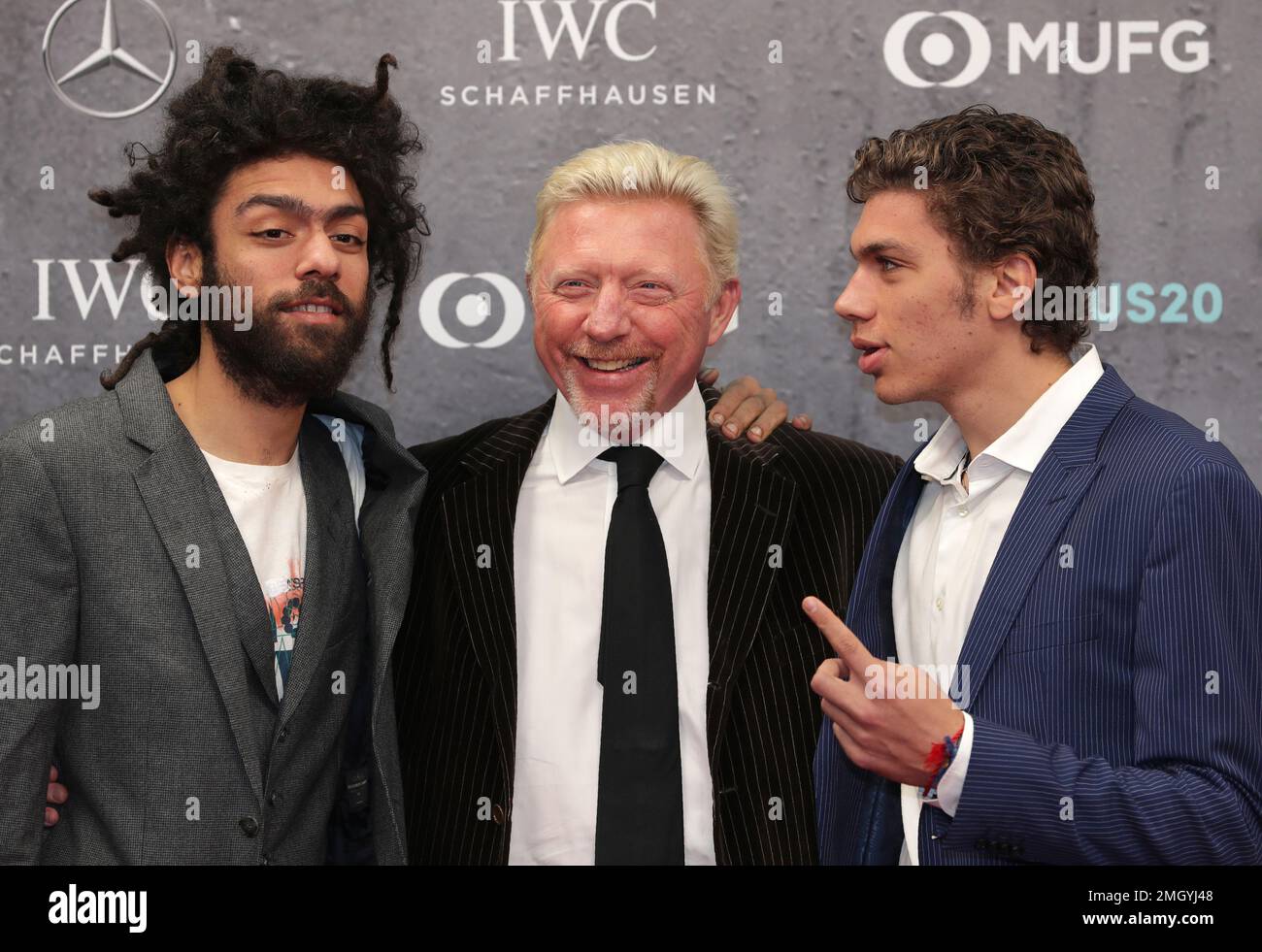German tennis great Boris Becker, center, poses for a photo with his ...
