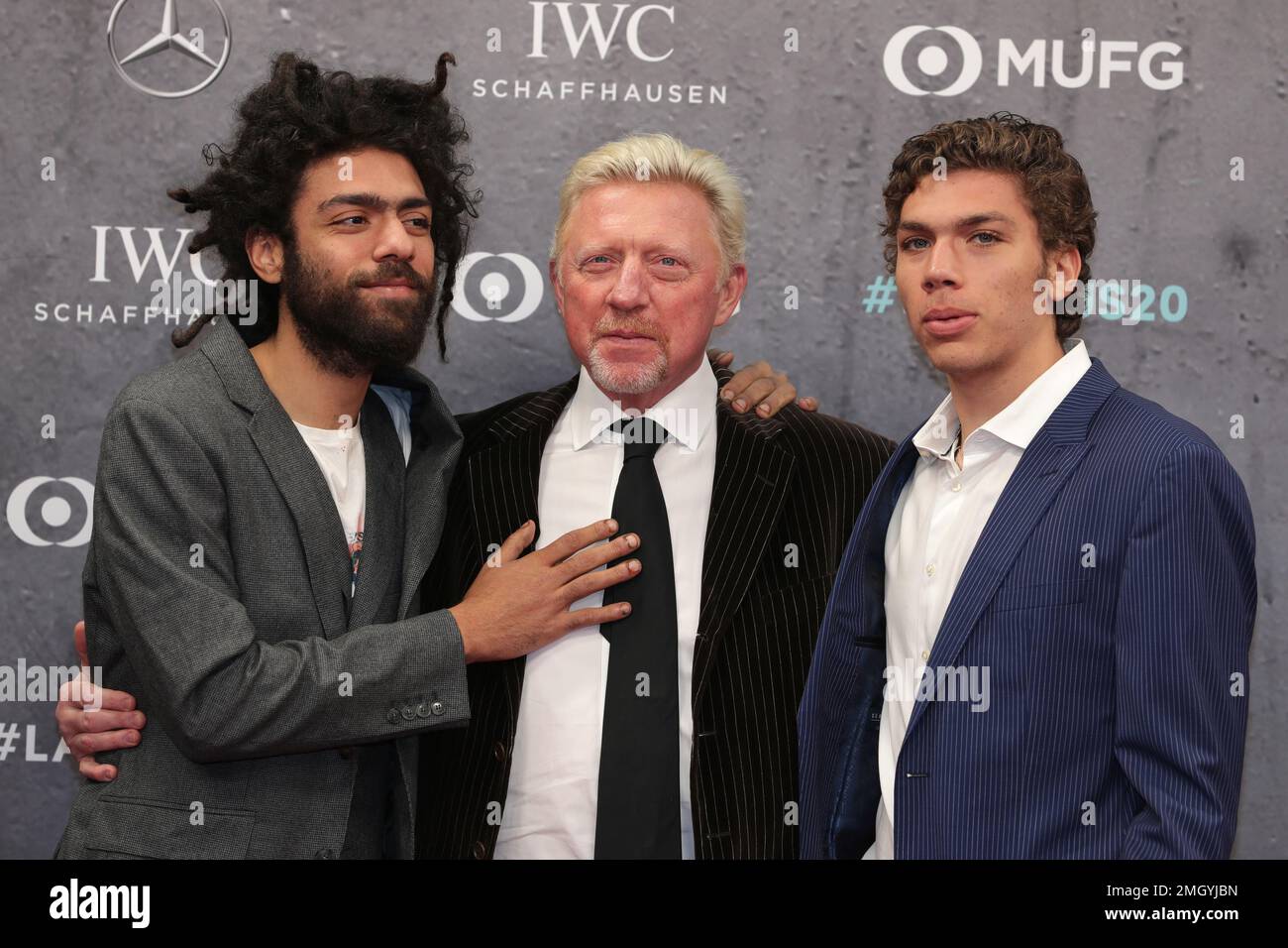 German tennis great Boris Becker, center, poses for a photo with his ...