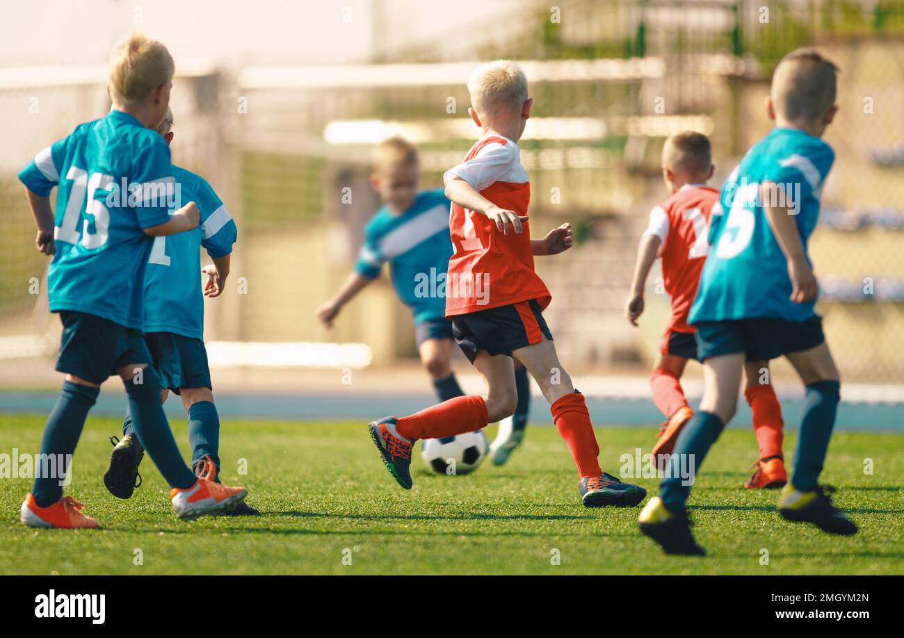 Football Soccer Game Between Kids. School Kids Play Football Match in ...