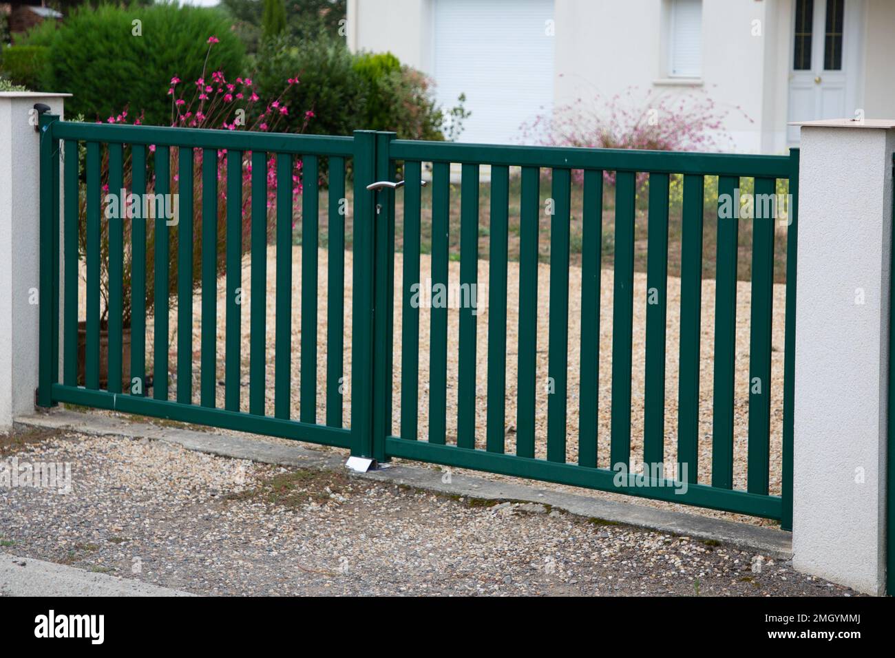 Aluminum large green car gate of modern house in street view Stock ...