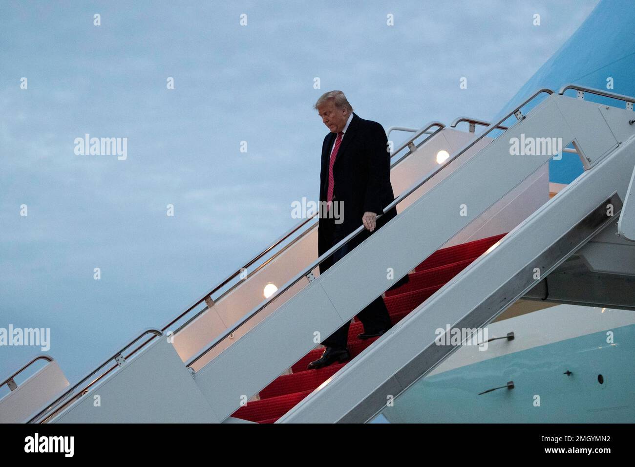 President Donald Trump steps off Air Force One as he arrives Sunday ...