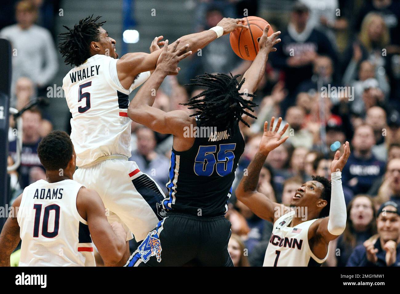 Connecticut's Isaiah Whaley (5) blocks a shot attempt by Memphis ...