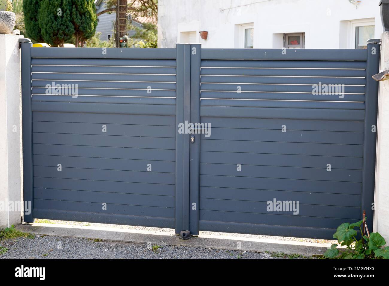 modern high grey gate aluminum portal car home access Stock Photo - Alamy