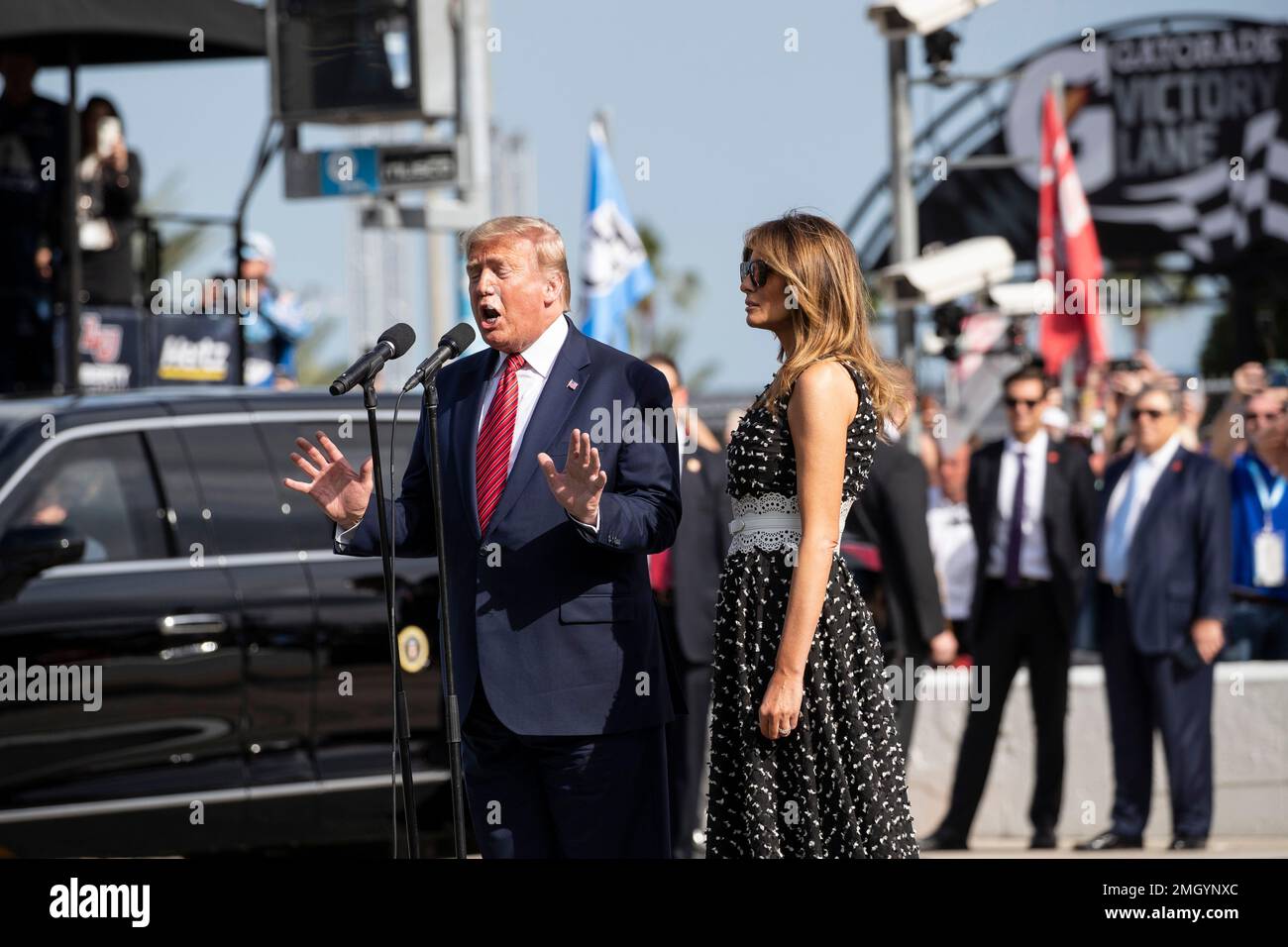 President Donald Trump, accompanied by first lady Melania Trump, gives ...