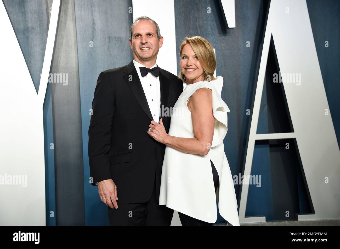 John Molner, left, and wife Katie Couric arrive at the Vanity Fair ...