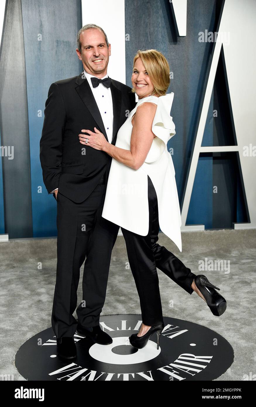John Molner, left, and wife Katie Couric arrive at the Vanity Fair ...