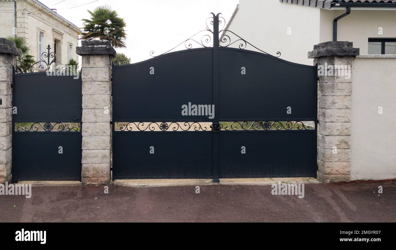 black dark gate of classic detached house in europe suburb street Stock ...