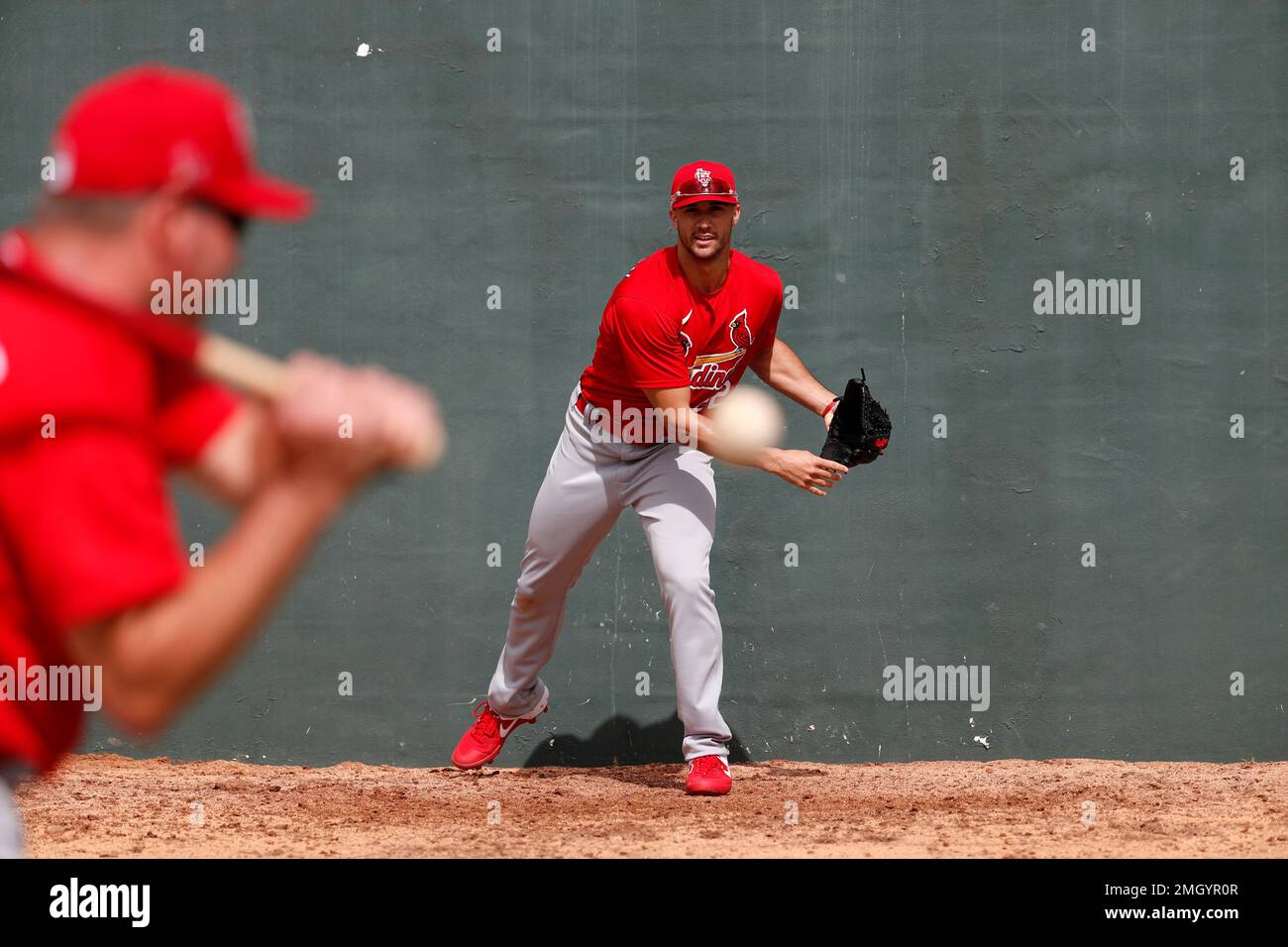 St. Louis Cardinals pitcher Jack Flaherty, right, works on fielding a ...
