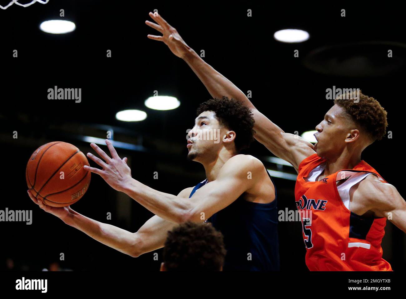Gonzaga guard Ryan Woolridge (4) goes up to basket under pressure from ...