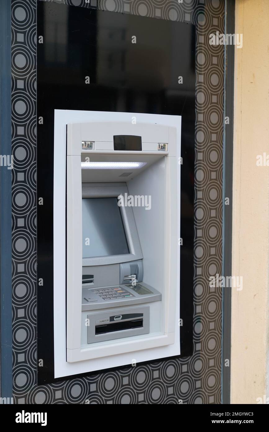 ATM machine on wall bank background for withdrawal of money and other ...