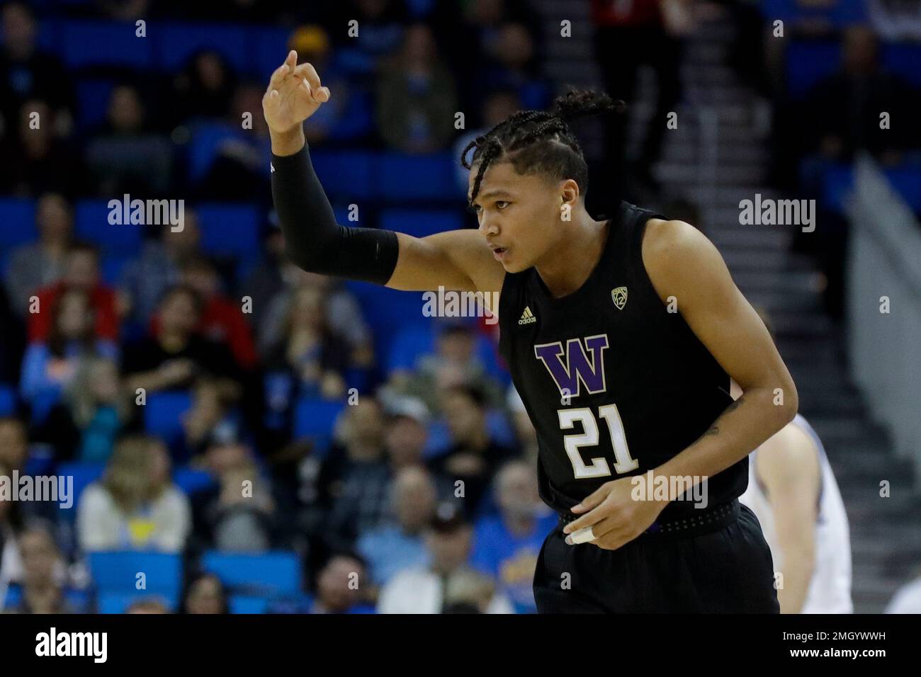 Washington forward RaeQuan Battle celebrates after scoring against UCLA ...