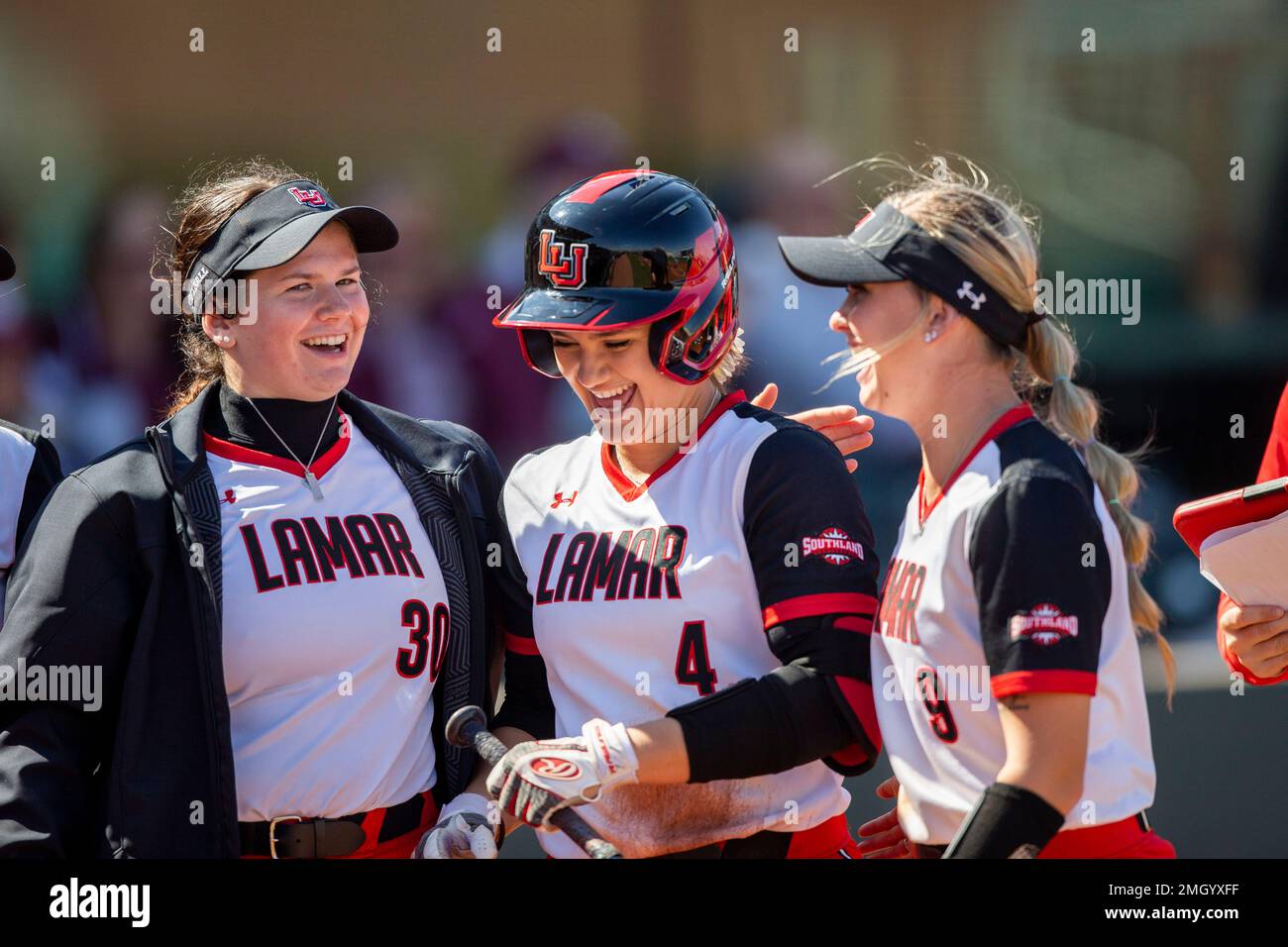 Lamar's Hannah Kinkade (4) reacts with with teammates Mackenzie Savage ...