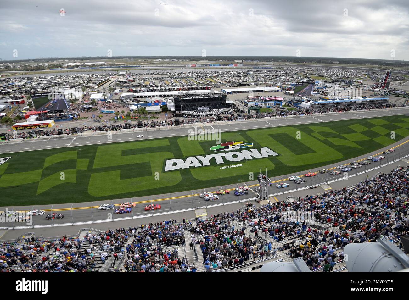 Drivers pass the front stretch at the start of a NASCAR Xfinity series ...