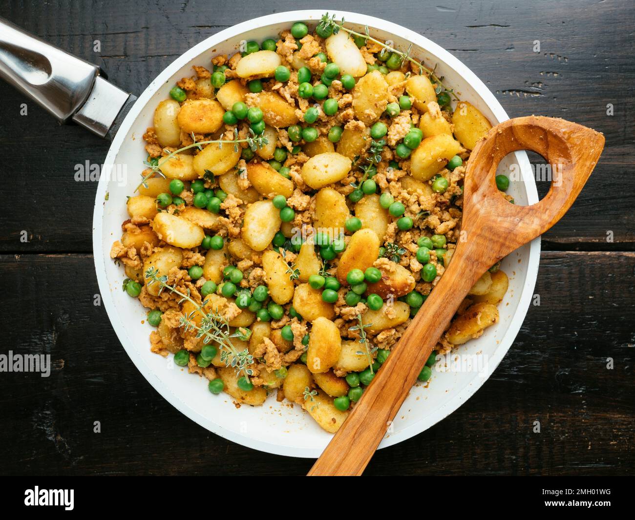 Frying pan with Gnocchi with Italian Spiced TVP and Peas Stock Photo ...