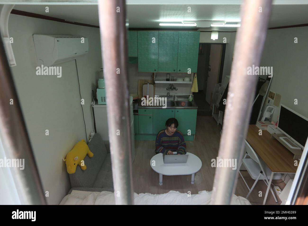 Kim Da-hye, a 29-year-old South Korean, sits with her laptop computer ...