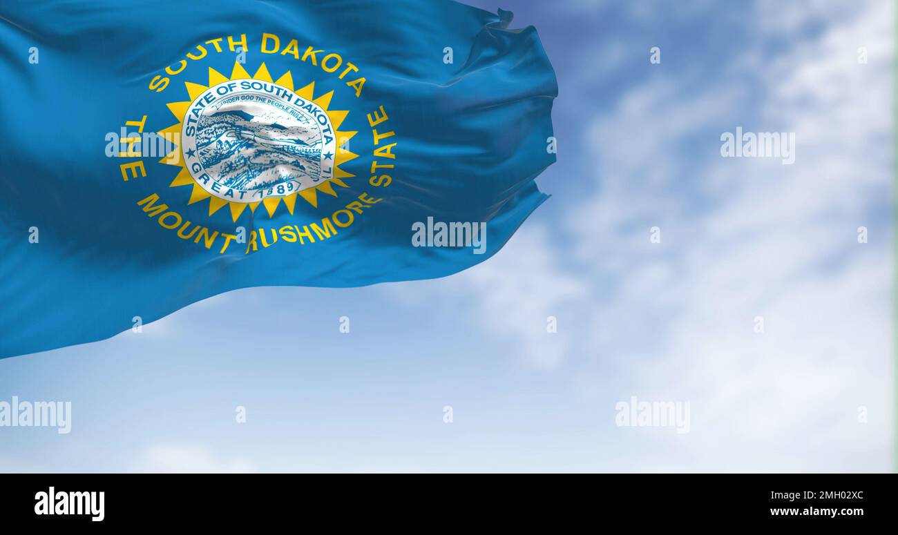 The South Dakota flag waving in the wind on a sunny day. A realistic 3D ...