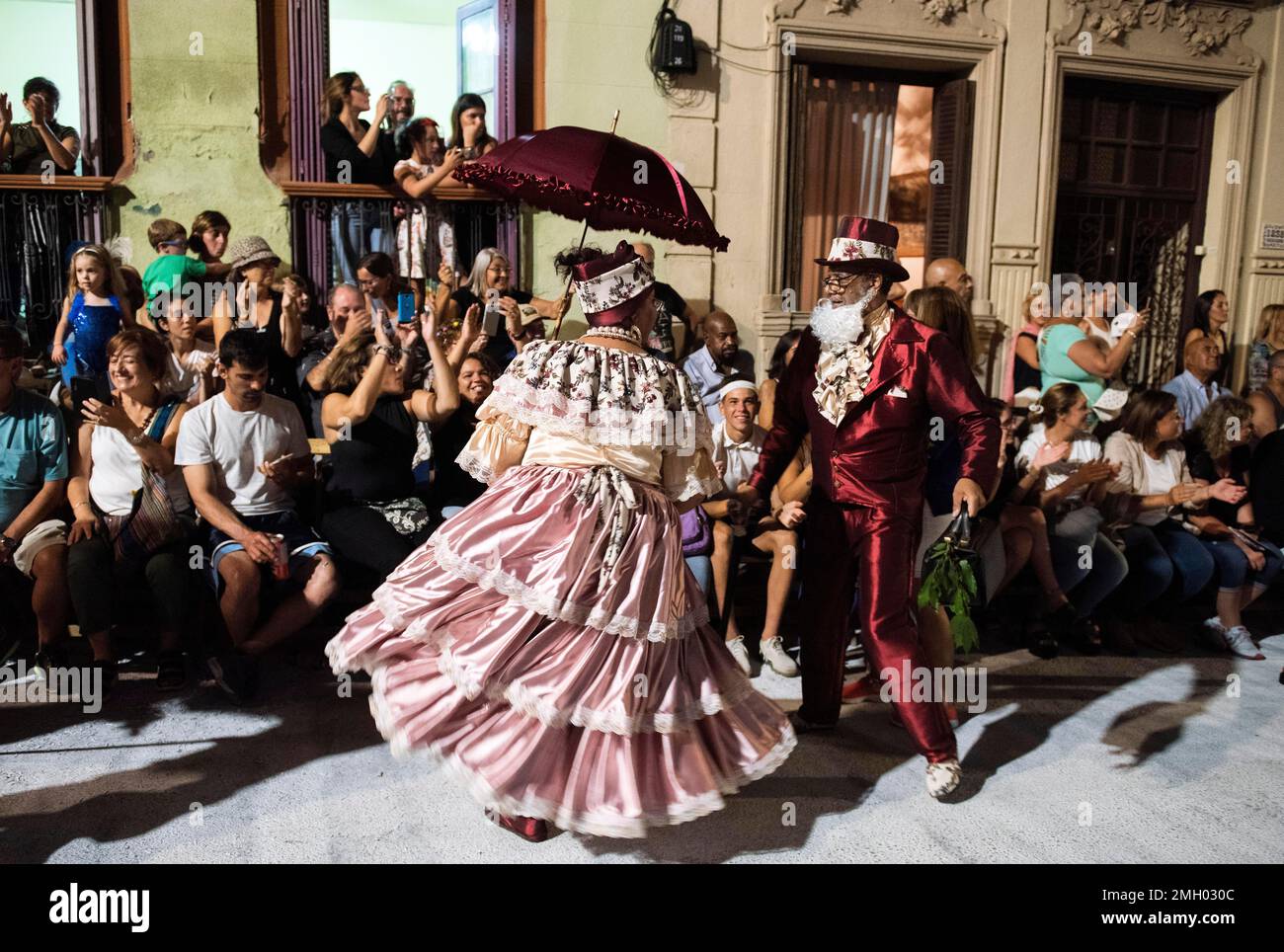 Traditional characters known as "Mama vieja" and "Gramillero" dance ...