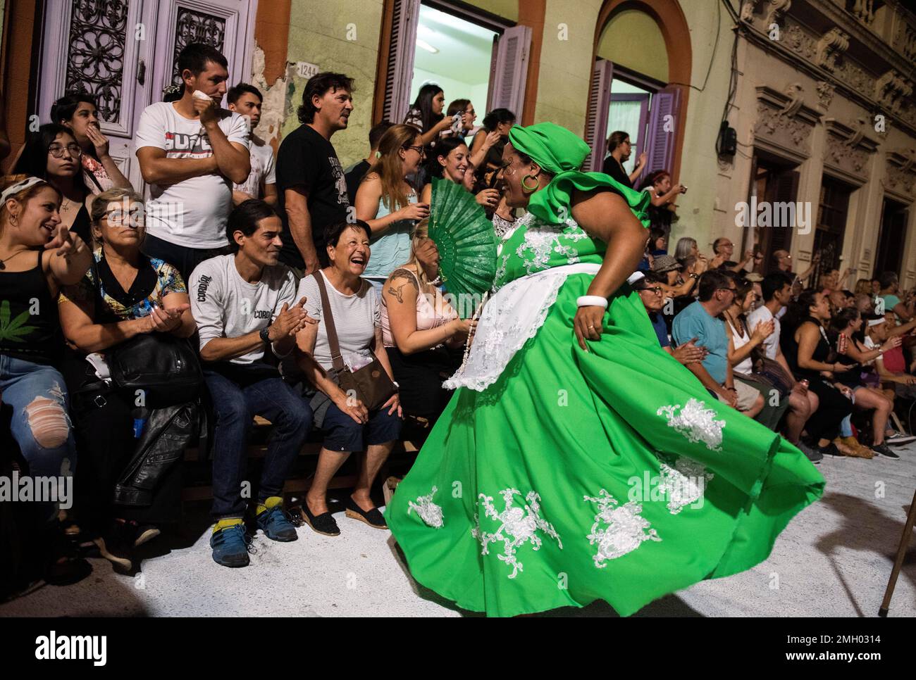Traditional characters known as "Mama vieja" dances candombe during Las ...