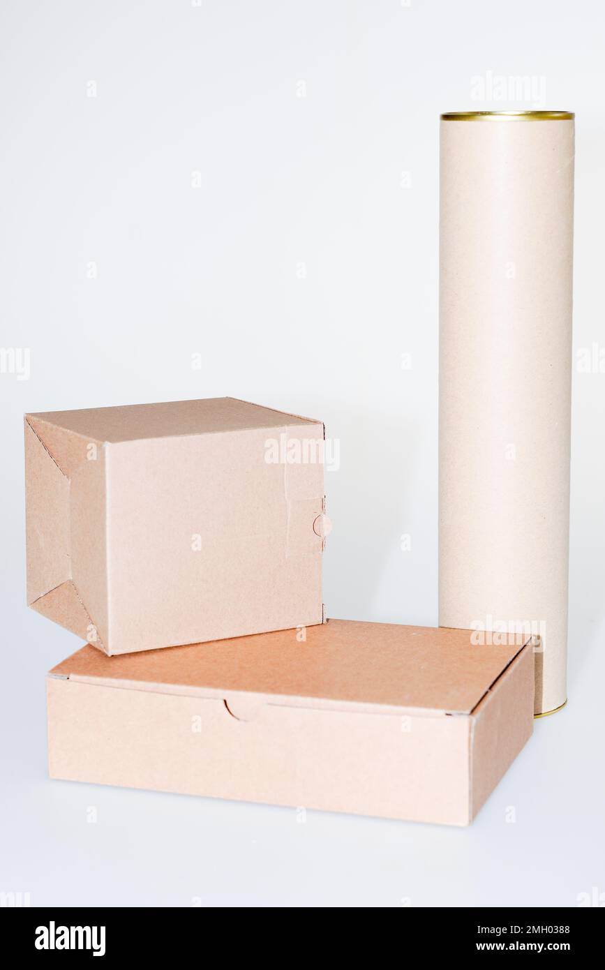 three cardboard boxes post on grey white background Stock Photo - Alamy
