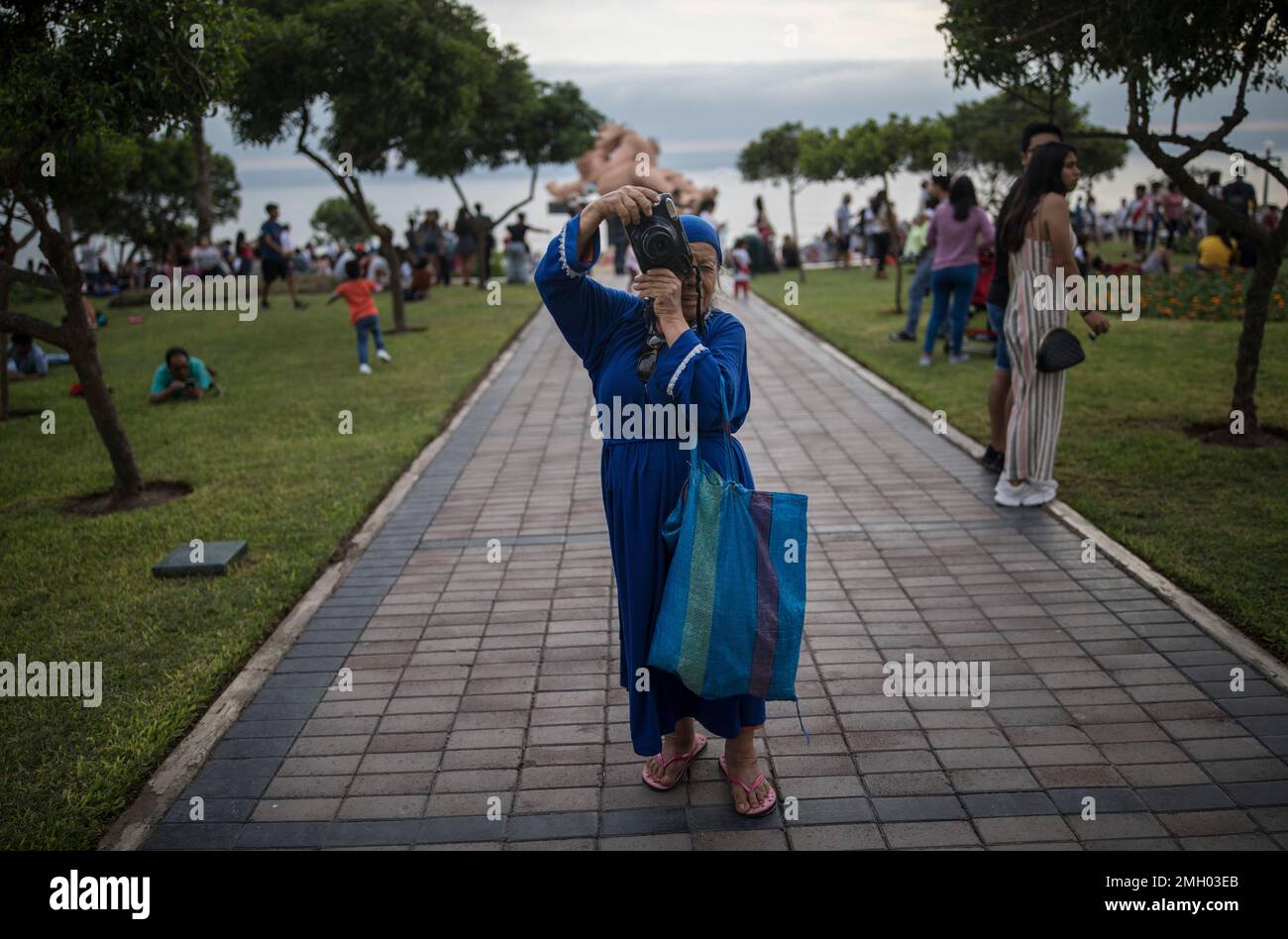 Street photographer Isabel Barrientos takes a portrait for 5 soles ...
