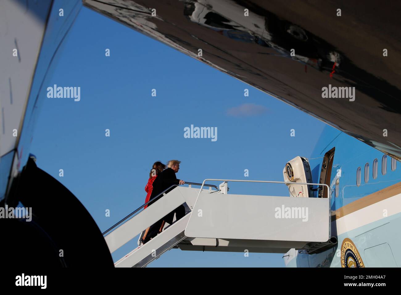 President Donald Trump and first lady Melania Trump board Air Force One ...