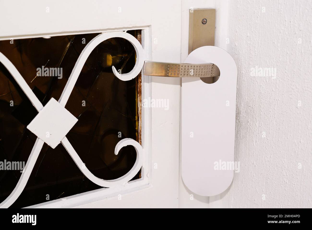 Entrance home with white door hanger of hotel room with empty sign ...