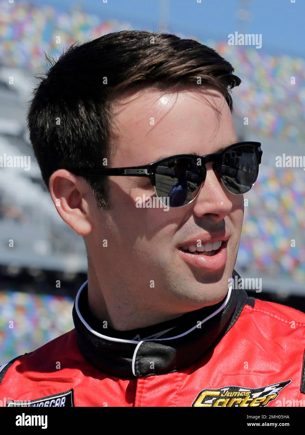 Timmy Hill walks down pit road during NASCAR auto race qualifying at ...