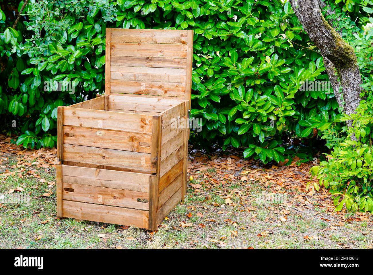 Worm composting wooden composter box in home garden Stock Photo - Alamy
