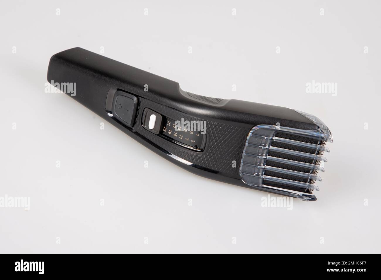black modern electric hair clipper on white background table in ...