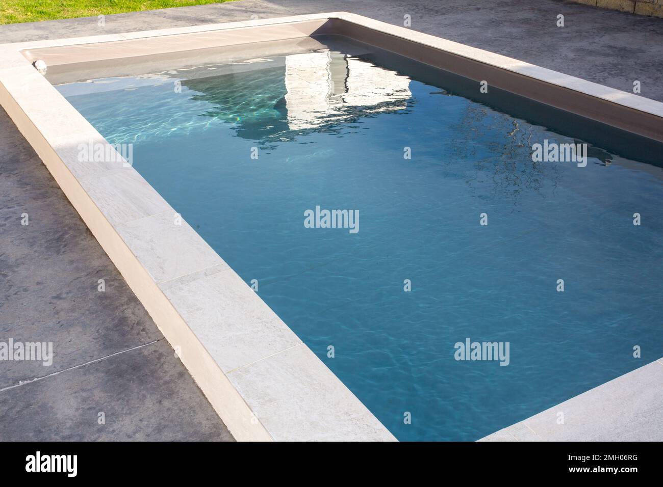 private family home swimming pool with stone coping with grey waxed ...