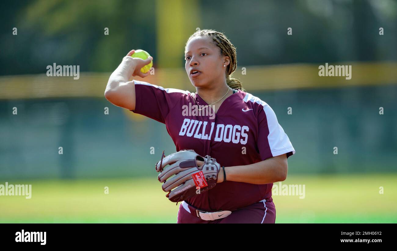 Alabama A&M first baseman Racheal McKinney throws during an NCAA ...