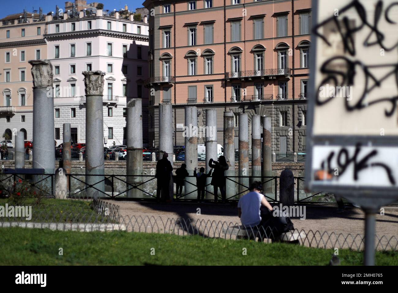 Tourists stop and take pictures in the archeological area of Largo ...
