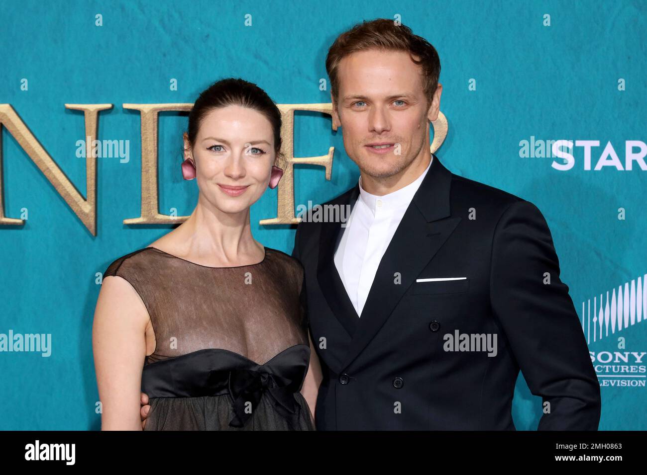 Caitriona Balfe, left, and Sam Heughan arrive at the Los Angeles premiere of "Outlander" Season ...