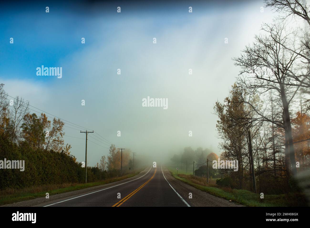 Morning drive in the fog Stock Photo - Alamy