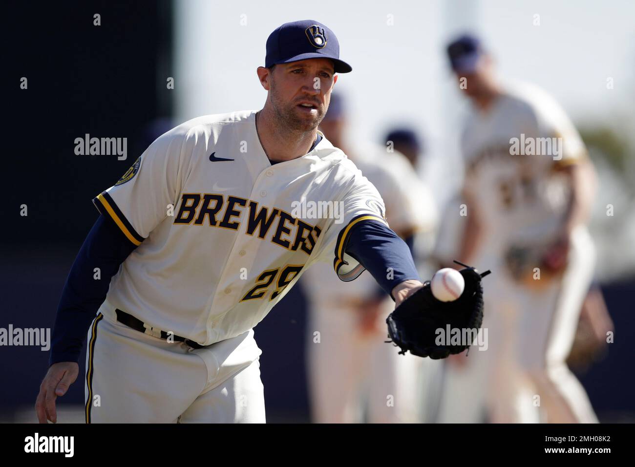 Milwaukee Brewers pitcher Josh Lindblom makes a catch during spring ...