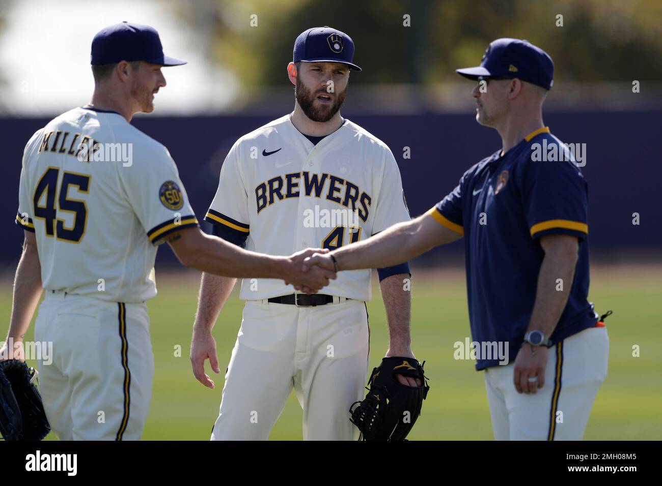 Milwaukee Brewers pitcher David Phelps, center, during spring training ...