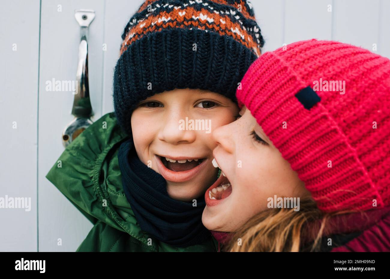 close up portrait of siblings singing together outside in the rain ...