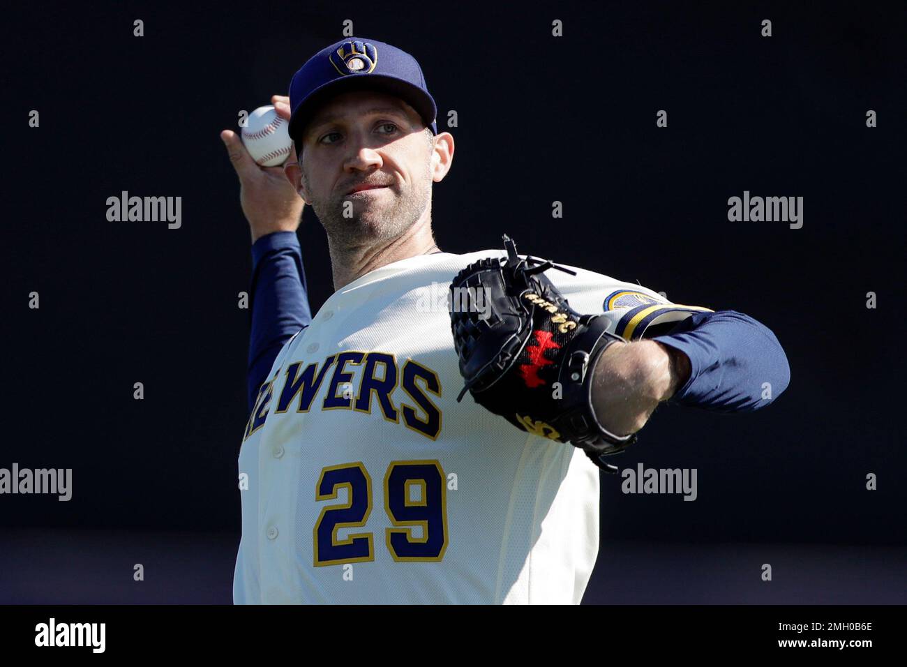 Milwaukee Brewers pitcher Josh Lindblom throws during baseball spring ...