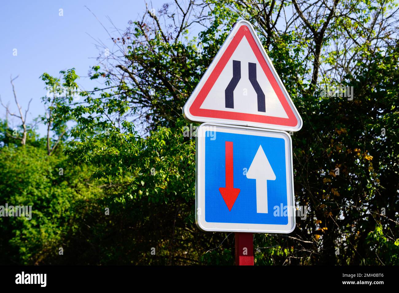 sign indicating a narrowing of the road in france European traffic ...