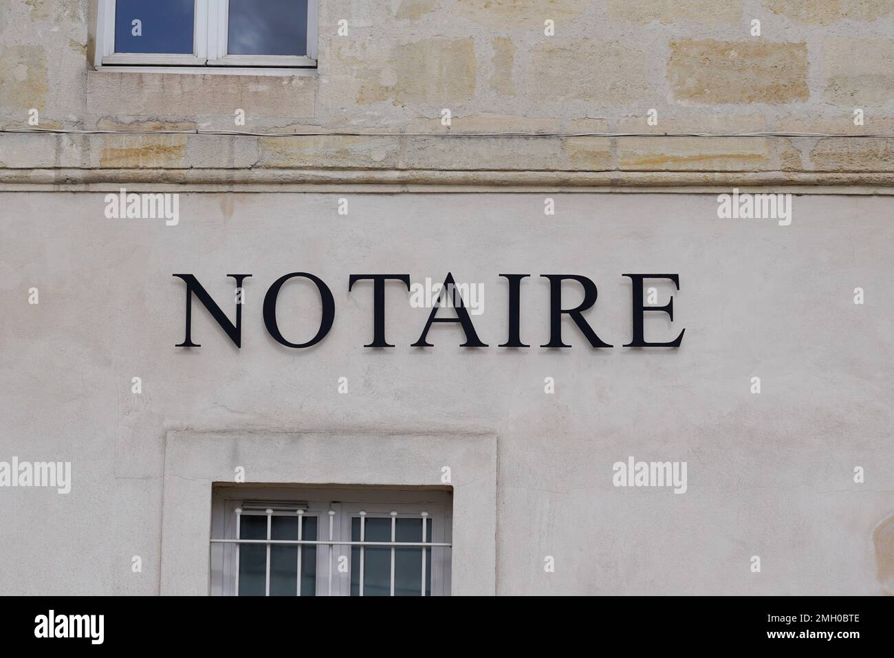 Notaire french text sign means office entrance notary sign in wall ...