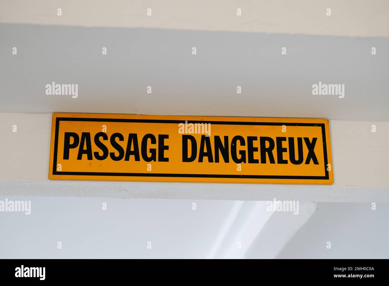 Passage dangereux french text means dangerous passage Stock Photo - Alamy