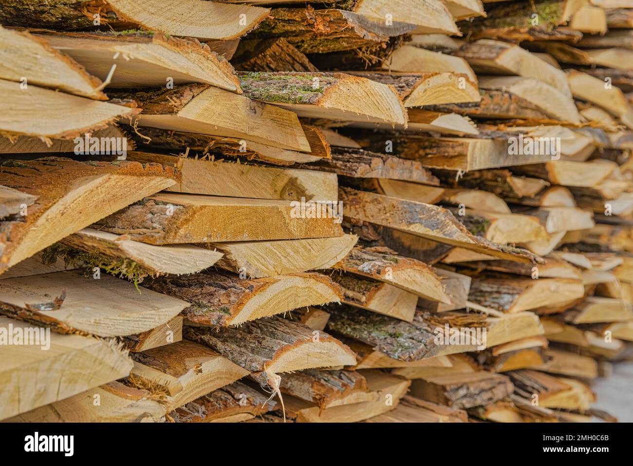 Stacked wood in the sawmill close up Stock Photo - Alamy