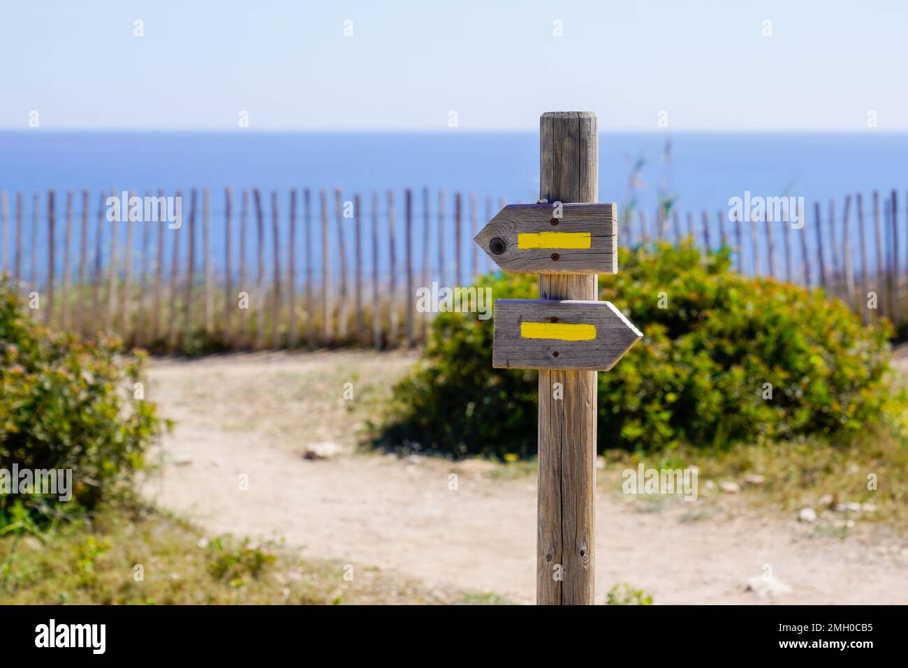yellow sign arrow markings for walking path hiking trails pathway in ...