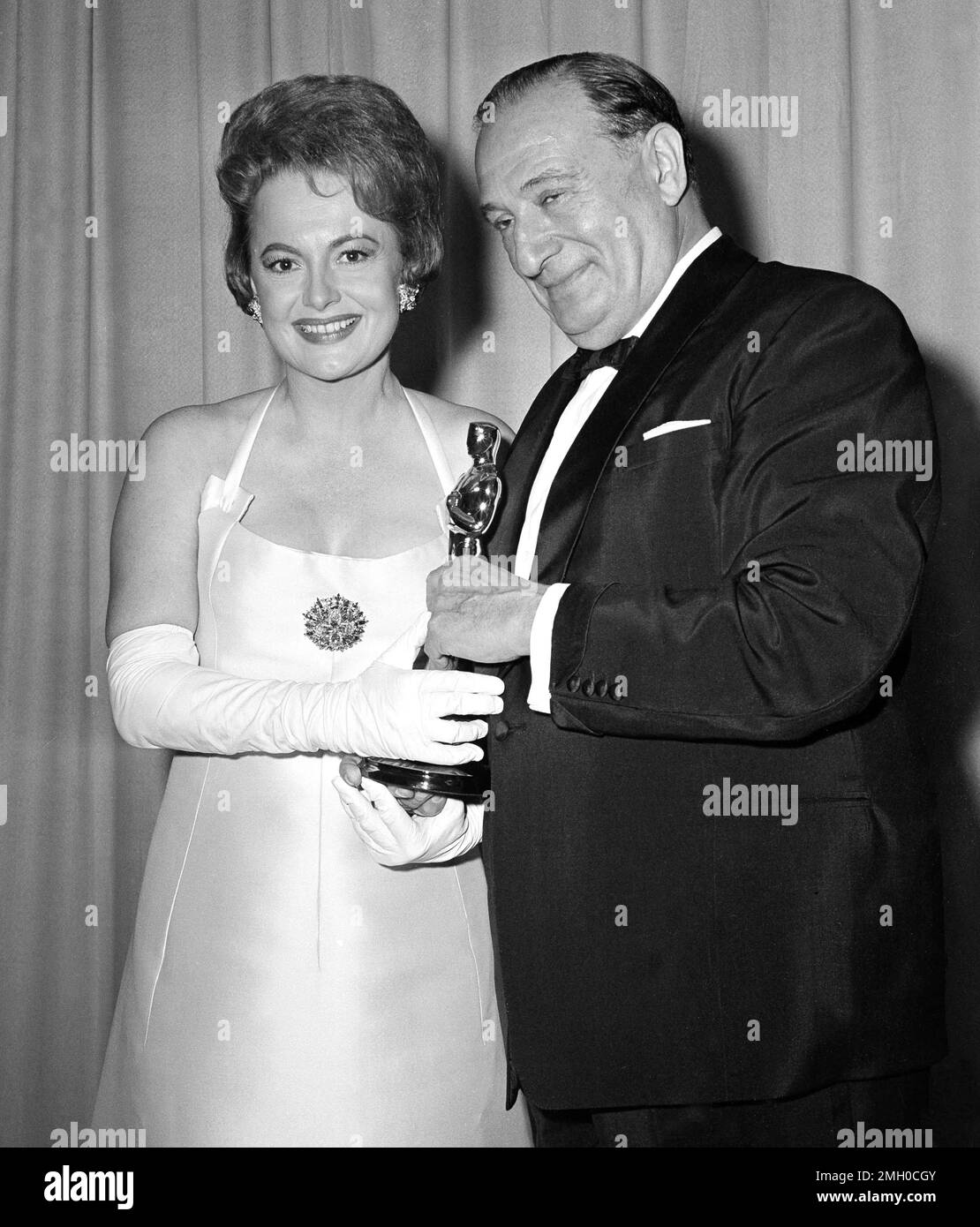 Actor Olivia de Havilland poses with producer Sam Spiegel, who won an ...