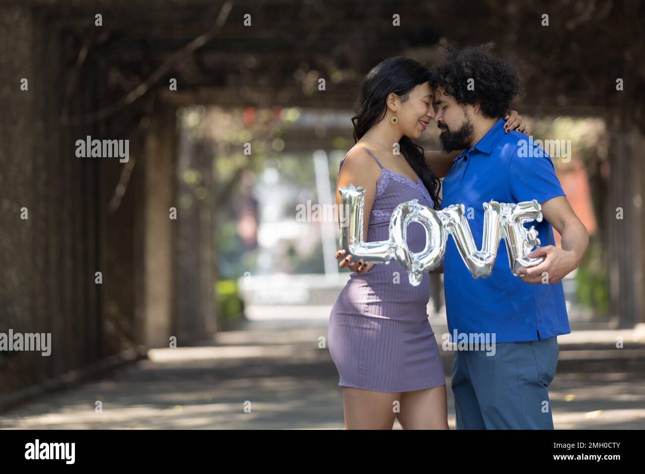 face to face Mexican young couple, real love concept Stock Photo - Alamy